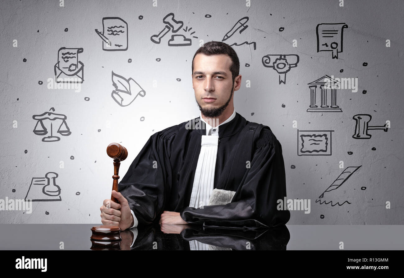 Handsome judge with court symbols around Stock Photo - Alamy