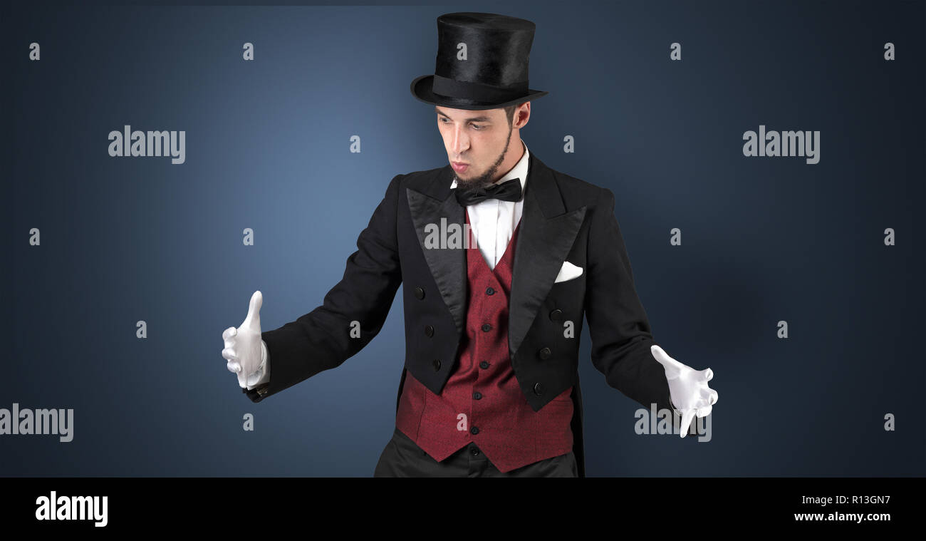 Handsome magician with no graph holds something invisible Stock Photo ...