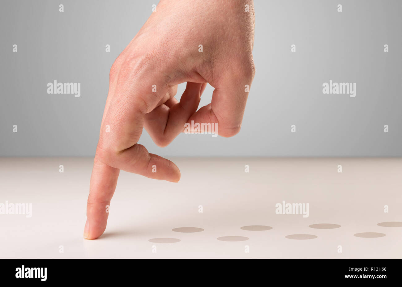 Female fingers walking with dots behind them Stock Photo - Alamy