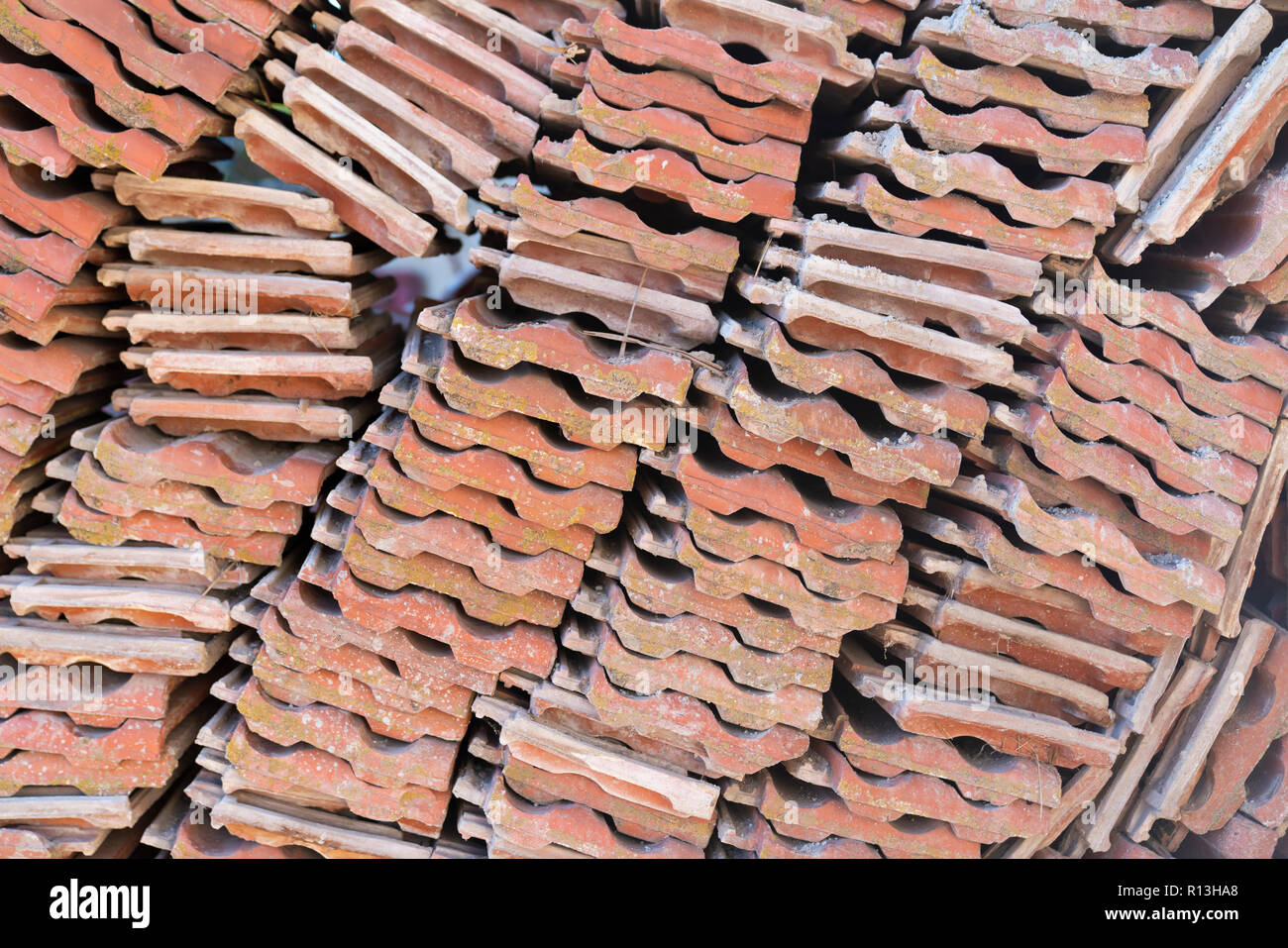 Red clay roof tile put in the stack after old tenement renovation in ...