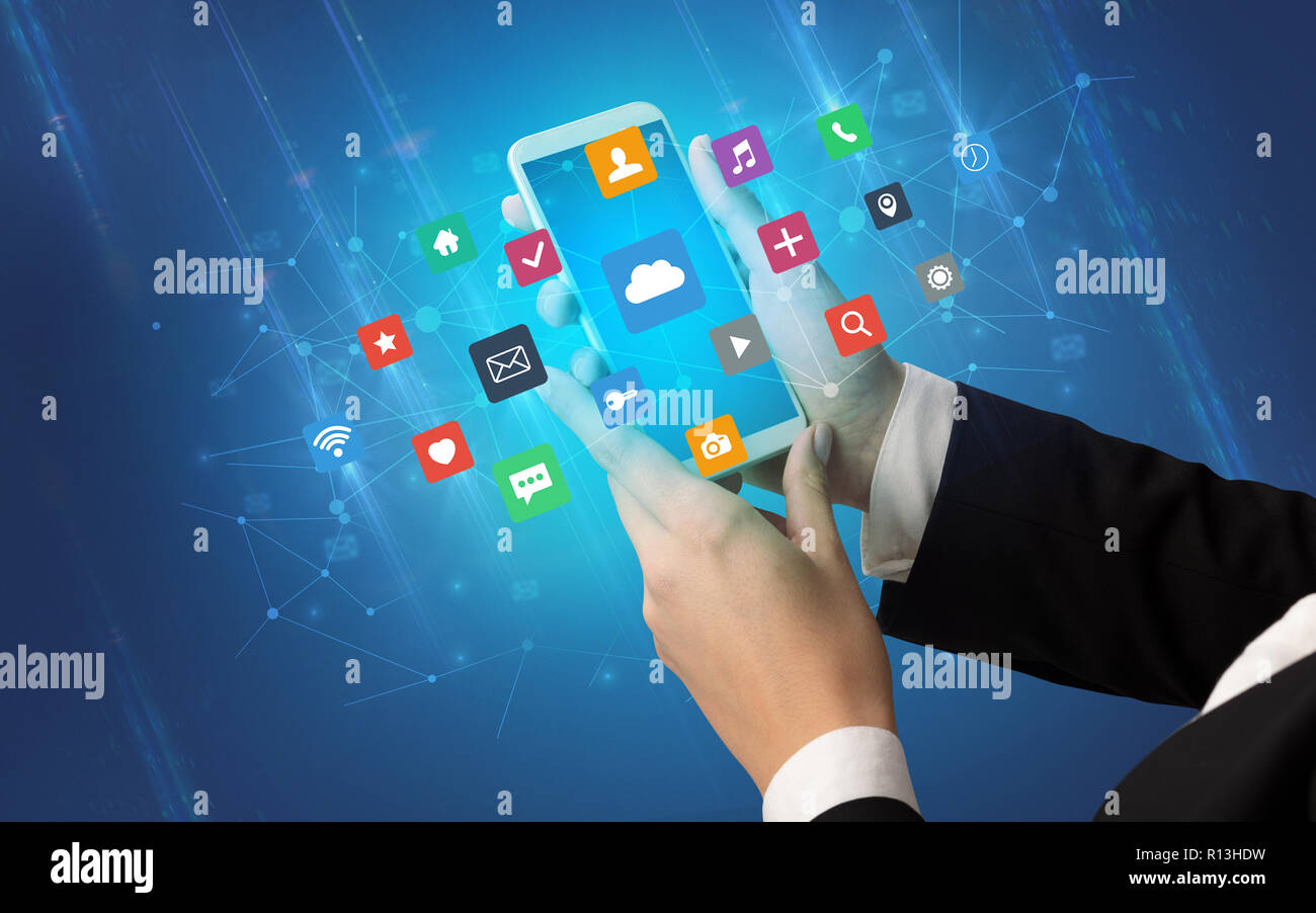 Female hand using smartphone with colorful application icons around ...
