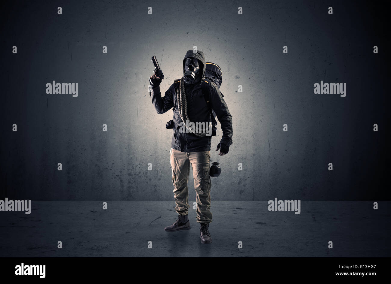 Bad agent in a dark room with arms on his hand and gas mask Stock Photo ...