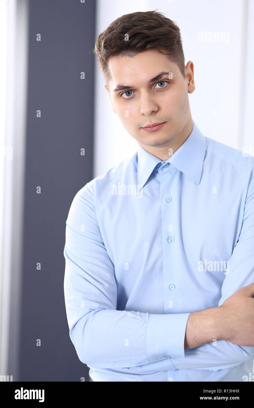 Young businessman standing straight in office. Business concept Stock ...