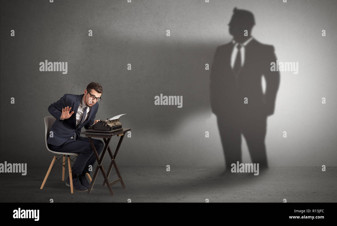 Shadow threatening hard worker man who is afraid Stock Photo - Alamy