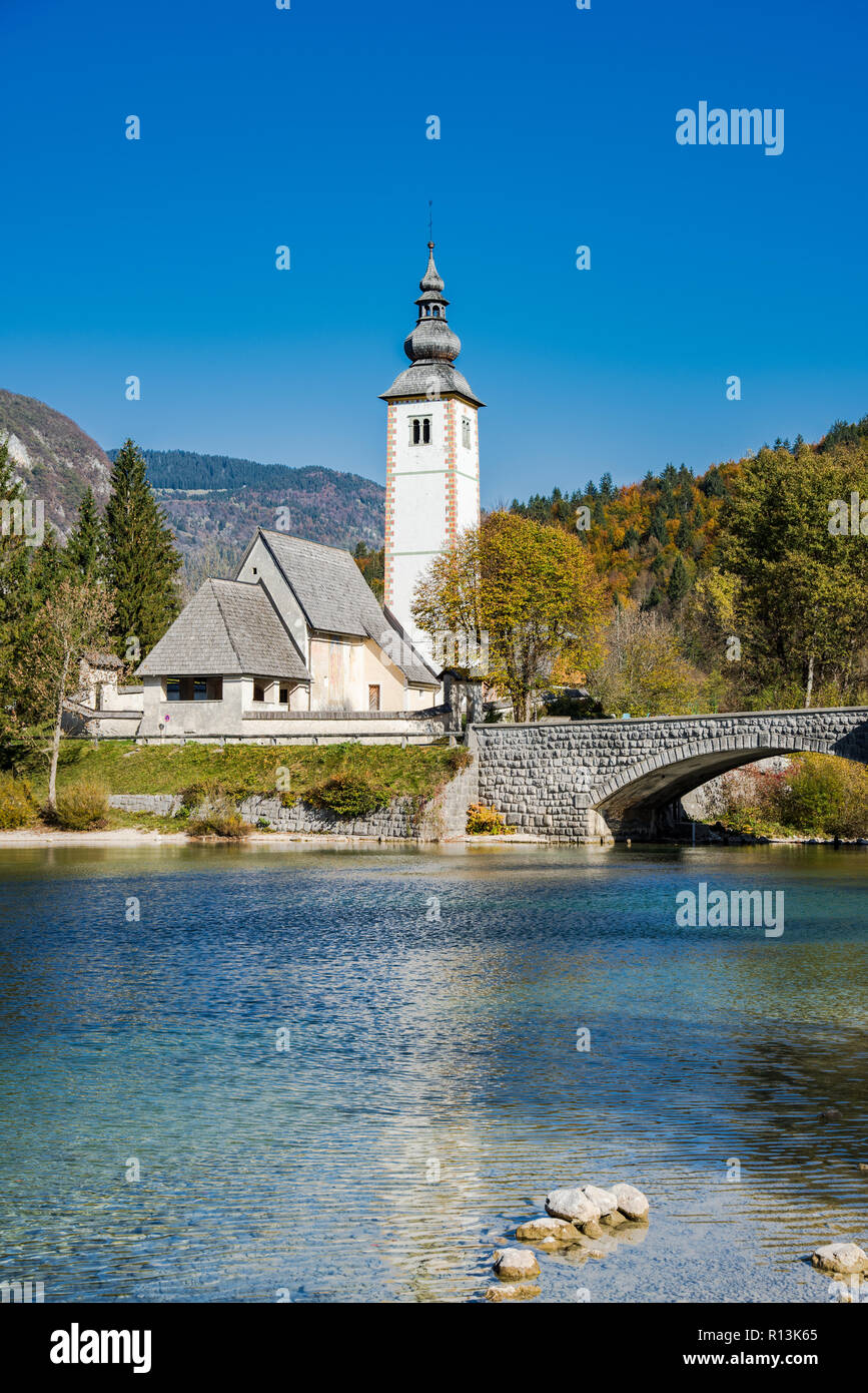 Gothic Church of St. John the Baptist and stone bridge in Ribcev Laz ...