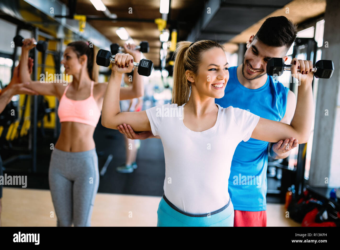 Working out in fitness center Stock Photo - Alamy