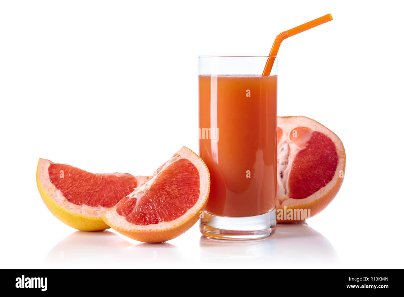 Glass of fresh grapefruit juice and cut fruits isolated on white ...