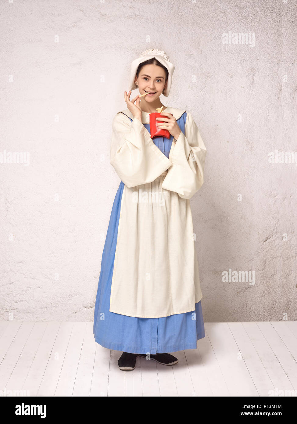 Medieval Woman in Historical Costume Wearing Corset Dress and Bonnet ...