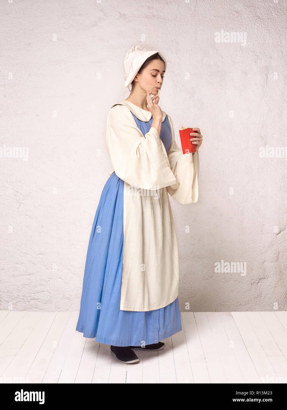 Medieval Woman in Historical Costume Wearing Corset Dress and Bonnet ...