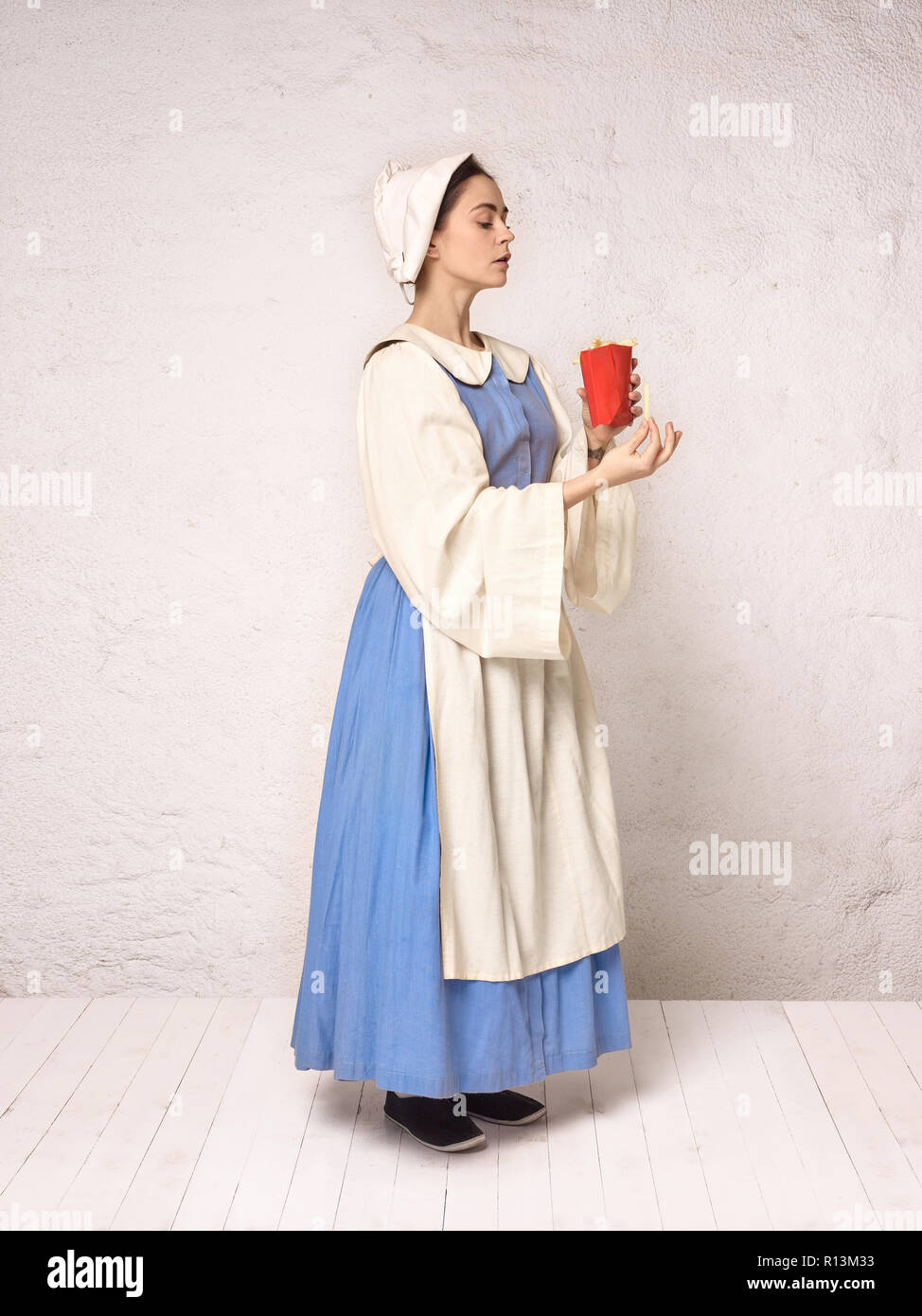 Medieval Woman in Historical Costume Wearing Corset Dress and Bonnet ...