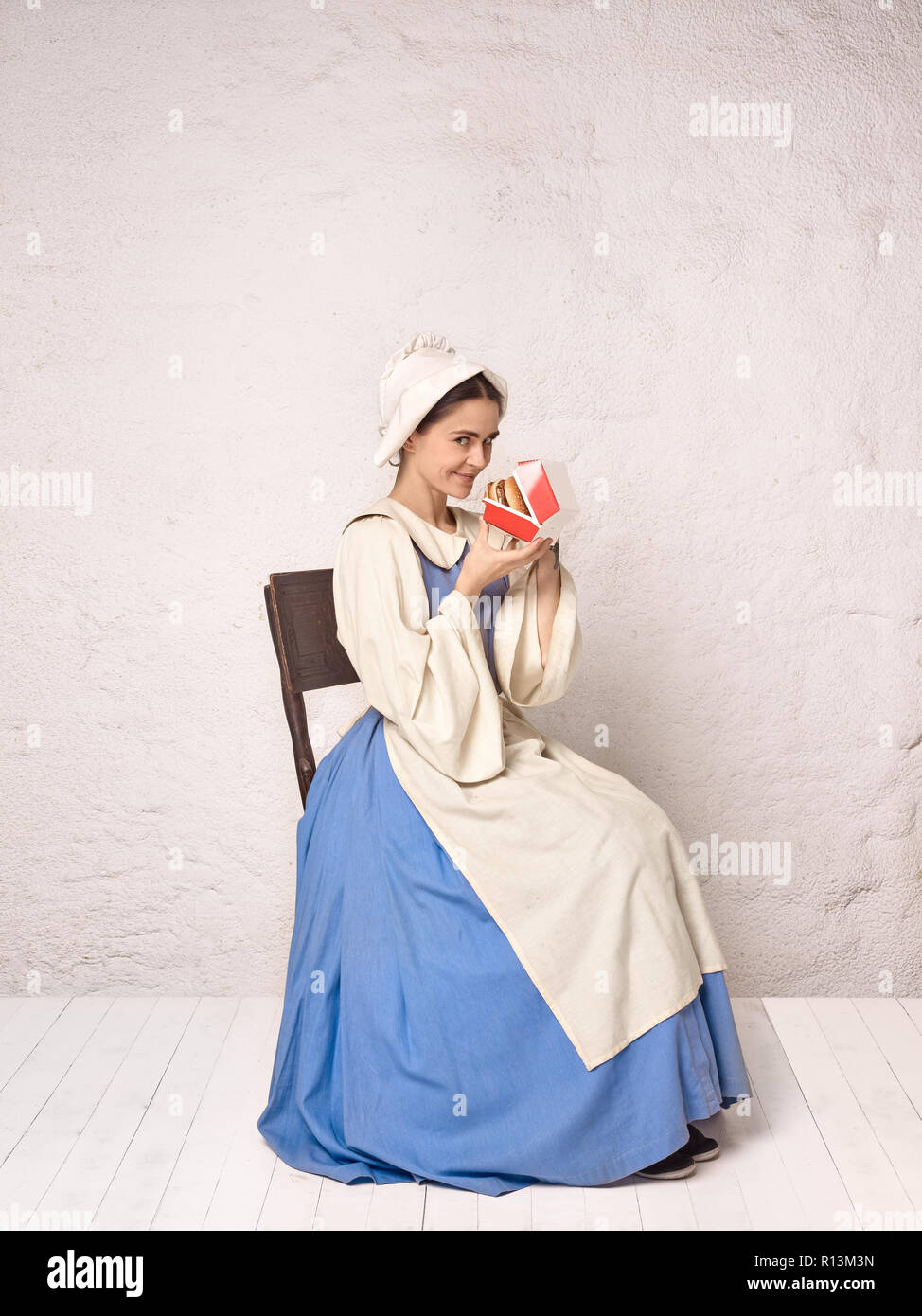 Medieval Woman in Historical Costume Wearing Corset Dress and Bonnet ...
