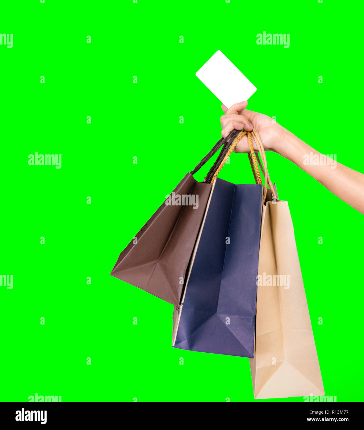 Woman consumer hand holding colorful shopping bag and credit card ...