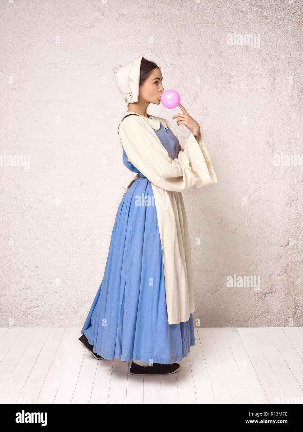 Medieval Woman in Historical Costume Wearing Corset Dress and Bonnet ...