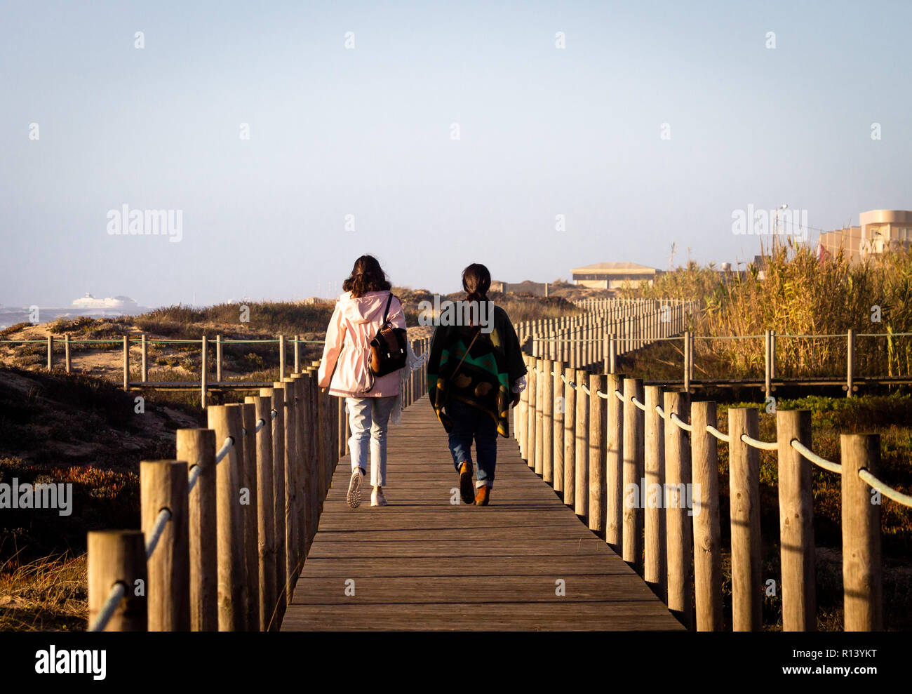 Back view two women outside walking hi-res stock photography and images ...
