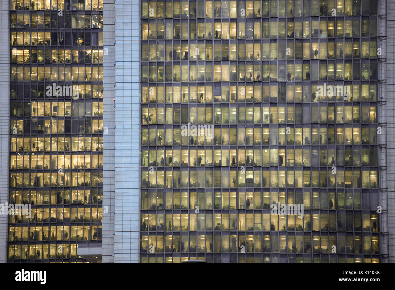 View of exterior windows with people at work in the interior of an ...