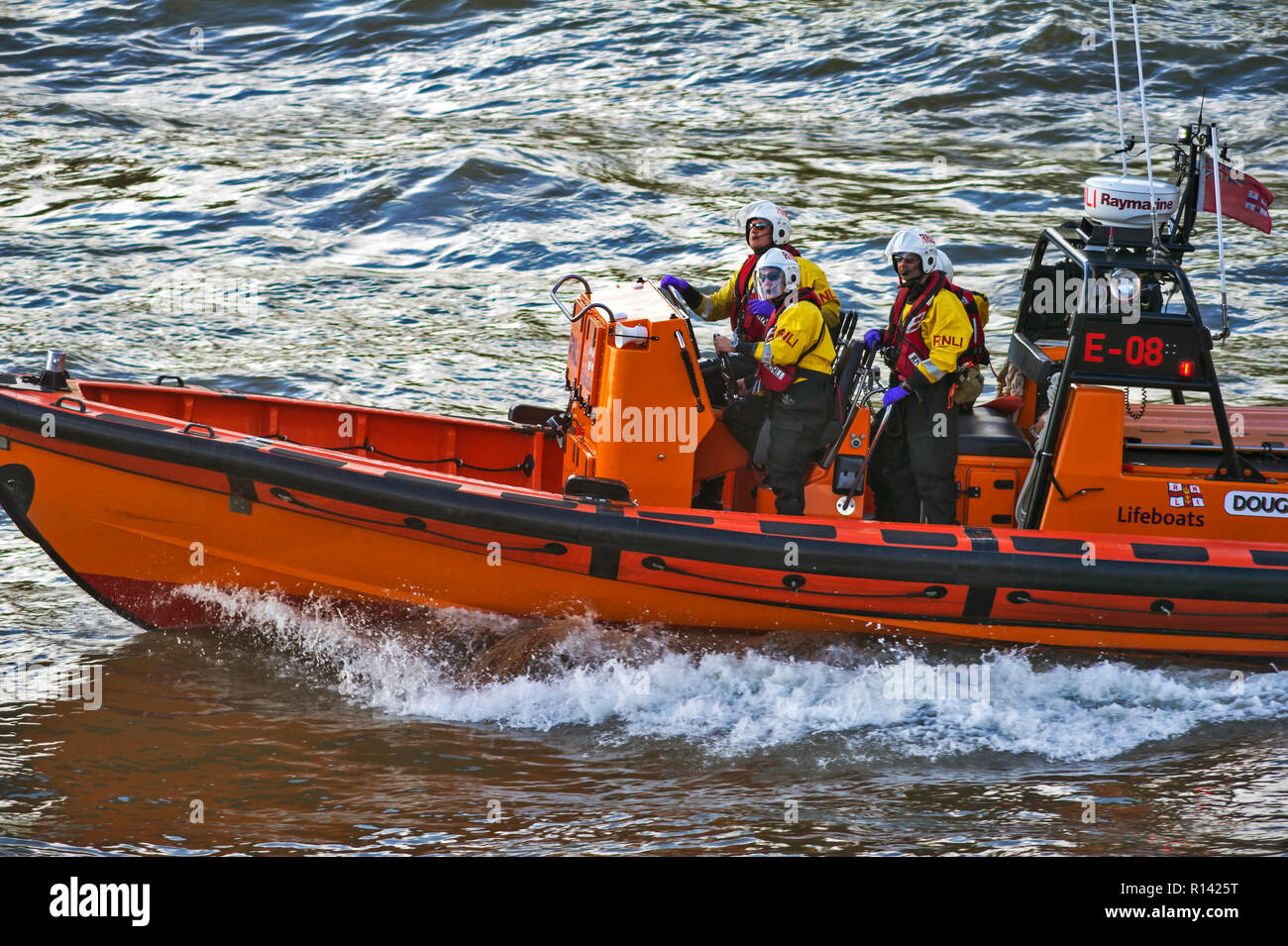Royal national lifeboat institution rnli boat along river hi-res stock ...