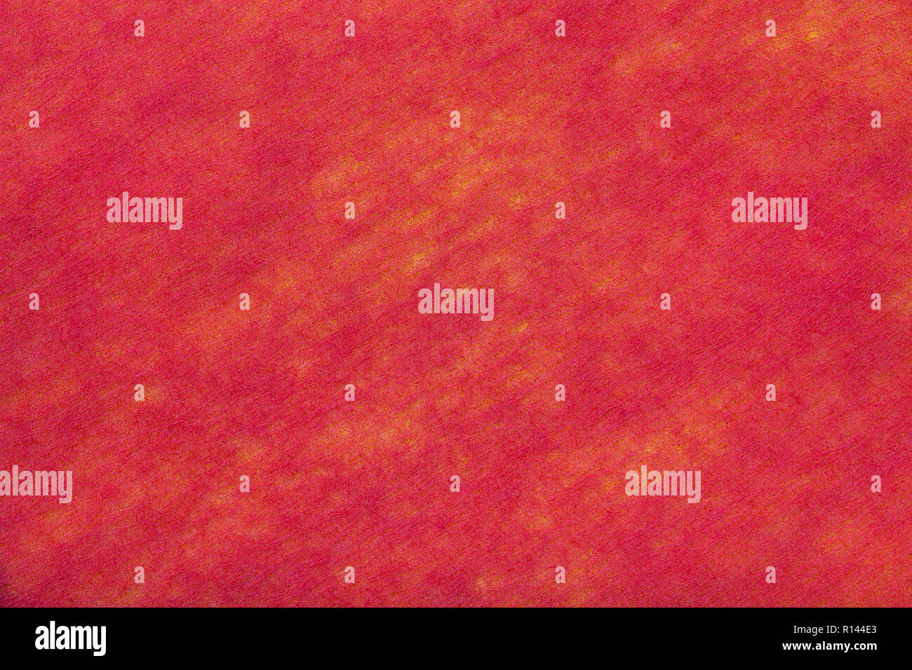 Construction of a bright red background with orange spots of felt ...