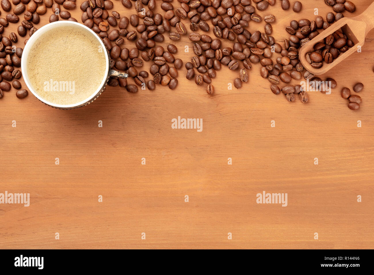 An overhead photo of coffee in a vintage cup, with coffee beans, a ...