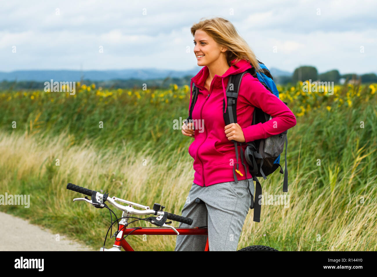 Female bike riding lane nature hi-res stock photography and images - Alamy