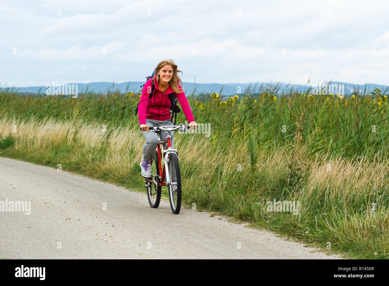 Female bike riding lane nature hi-res stock photography and images - Alamy