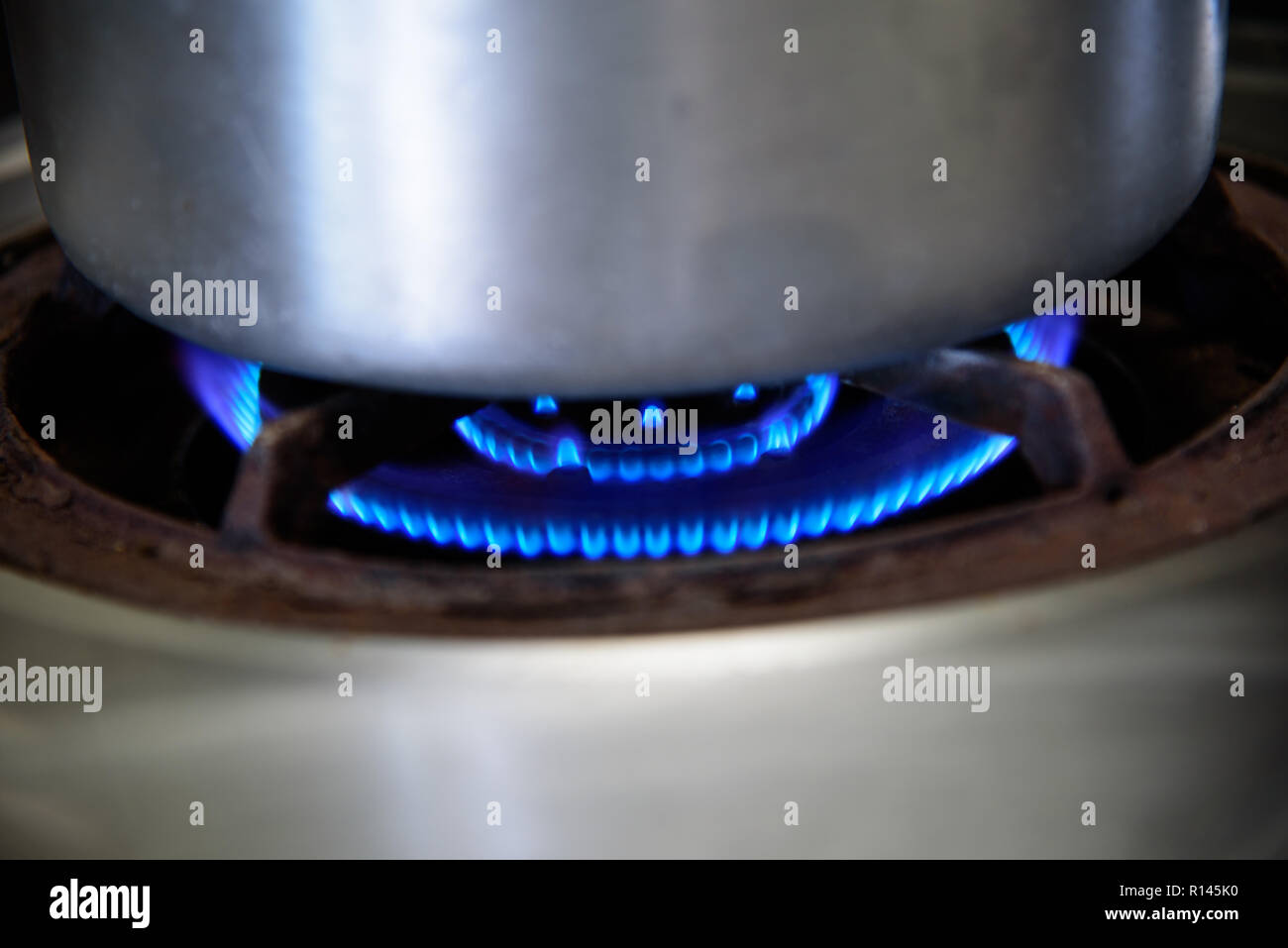 pot with fire of gas stove Stock Photo - Alamy