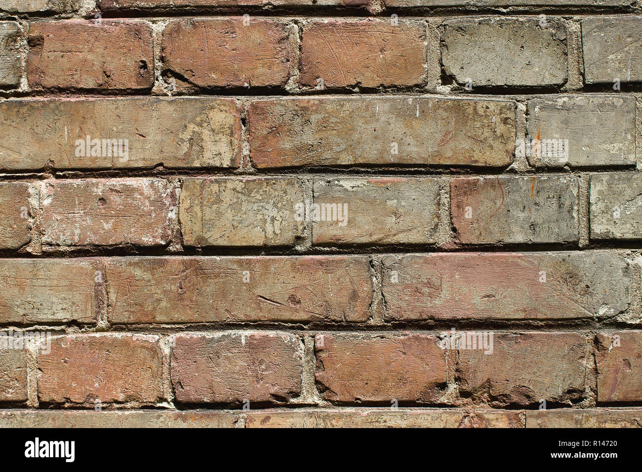 Red yellow brick wall with cement texture Stock Photo - Alamy