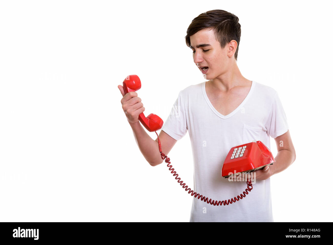 Teenage boy angry phone Cut Out Stock Images & Pictures - Alamy