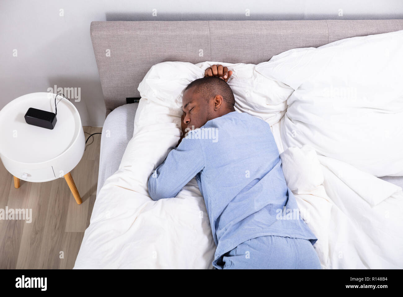 Young black man sleeping floor hi-res stock photography and images - Alamy