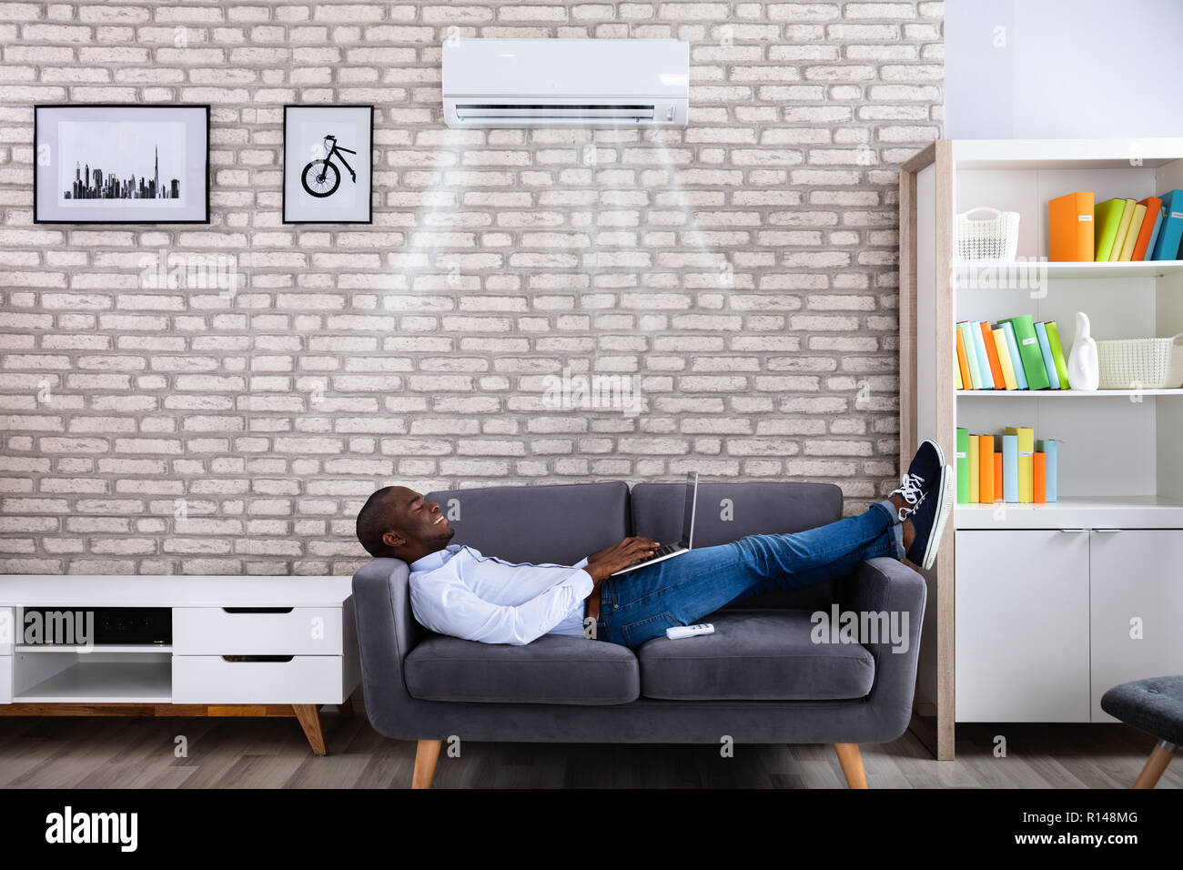 Man using portable air conditioner hi-res stock photography and images ...