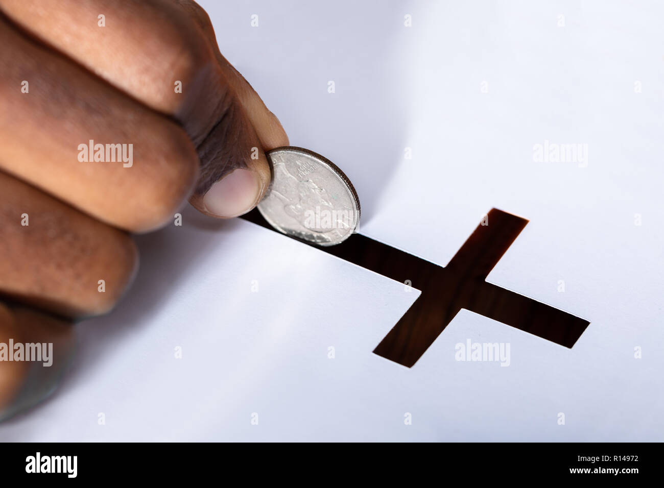 Putting coin in collection can hi-res stock photography and images - Alamy