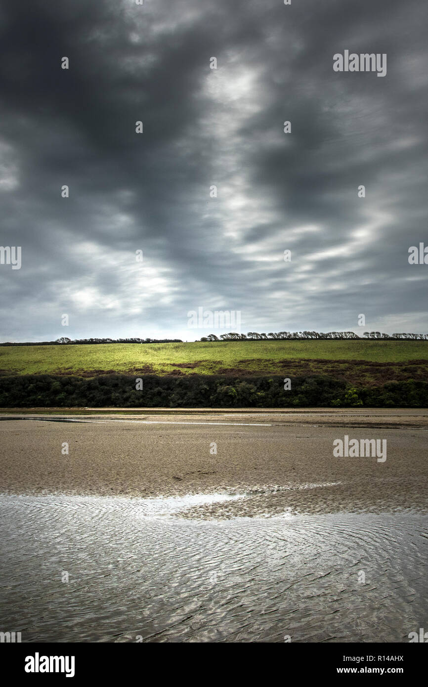 Late evening light at low tide in the Gannel Estuary in Newquay in ...