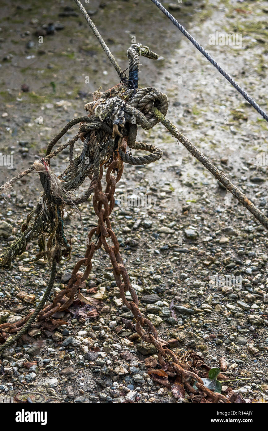 Ropes and chain knotted together Stock Photo - Alamy