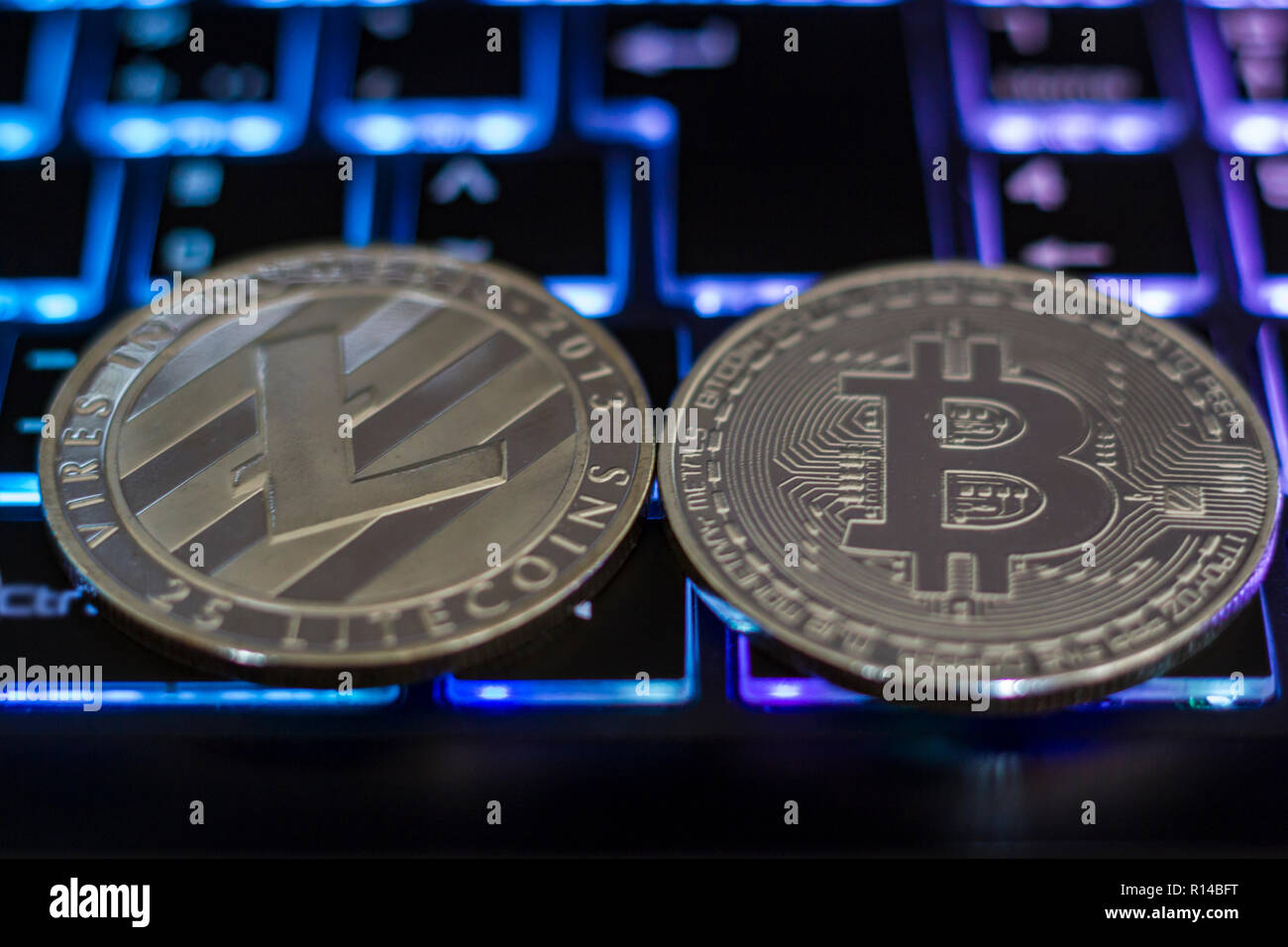 Cryptocurrency coins on computer keyboard Stock Photo - Alamy