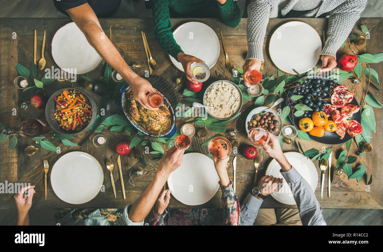Flat-lay of friends or family feasting at festive table Stock Photo - Alamy