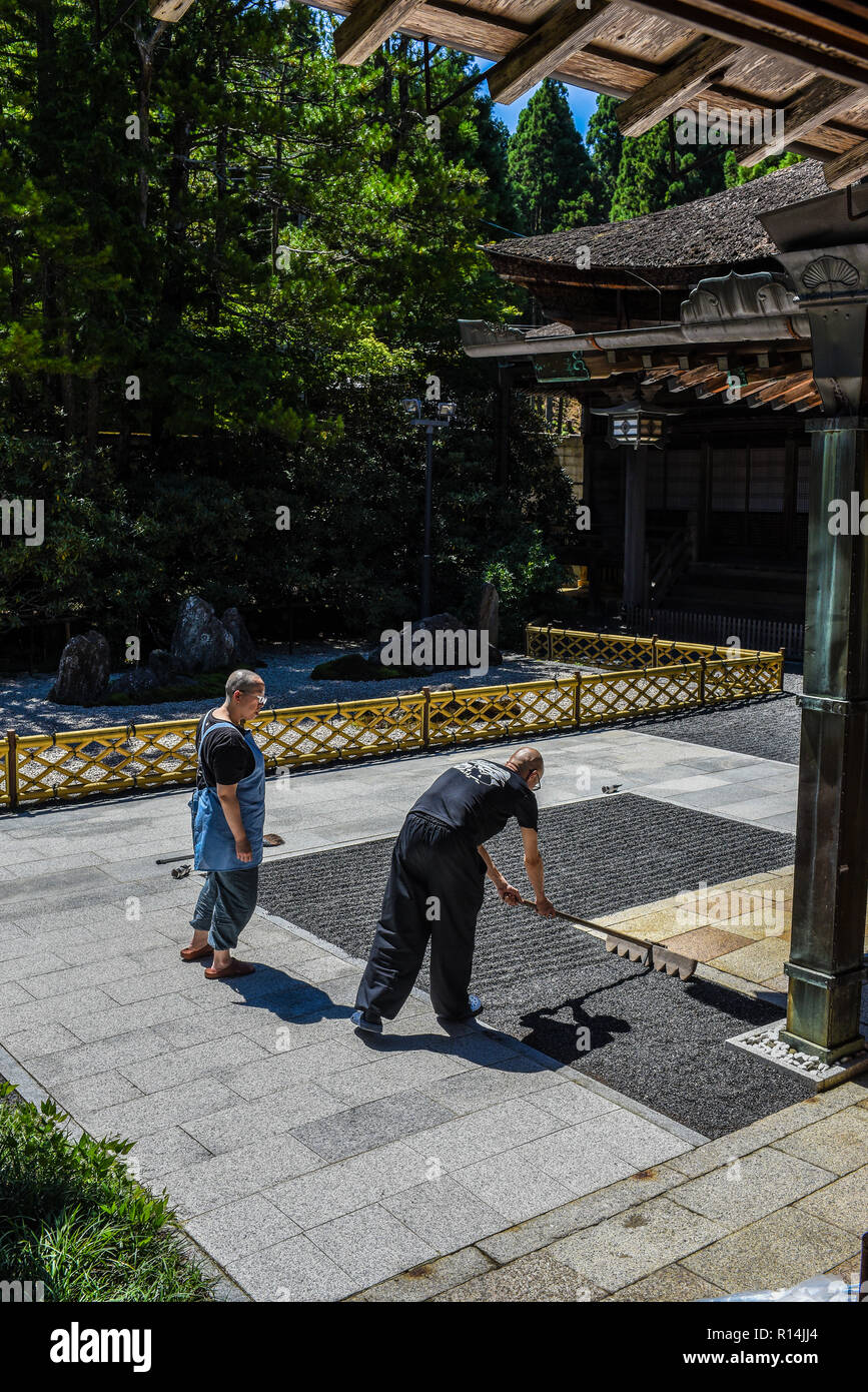 Monks working on zen garden hi-res stock photography and images - Alamy