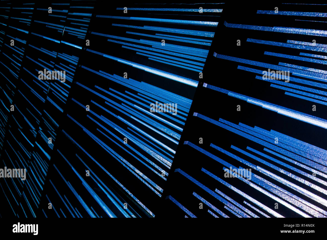 Colorful streaks of light show diminishing perspective and create a ...