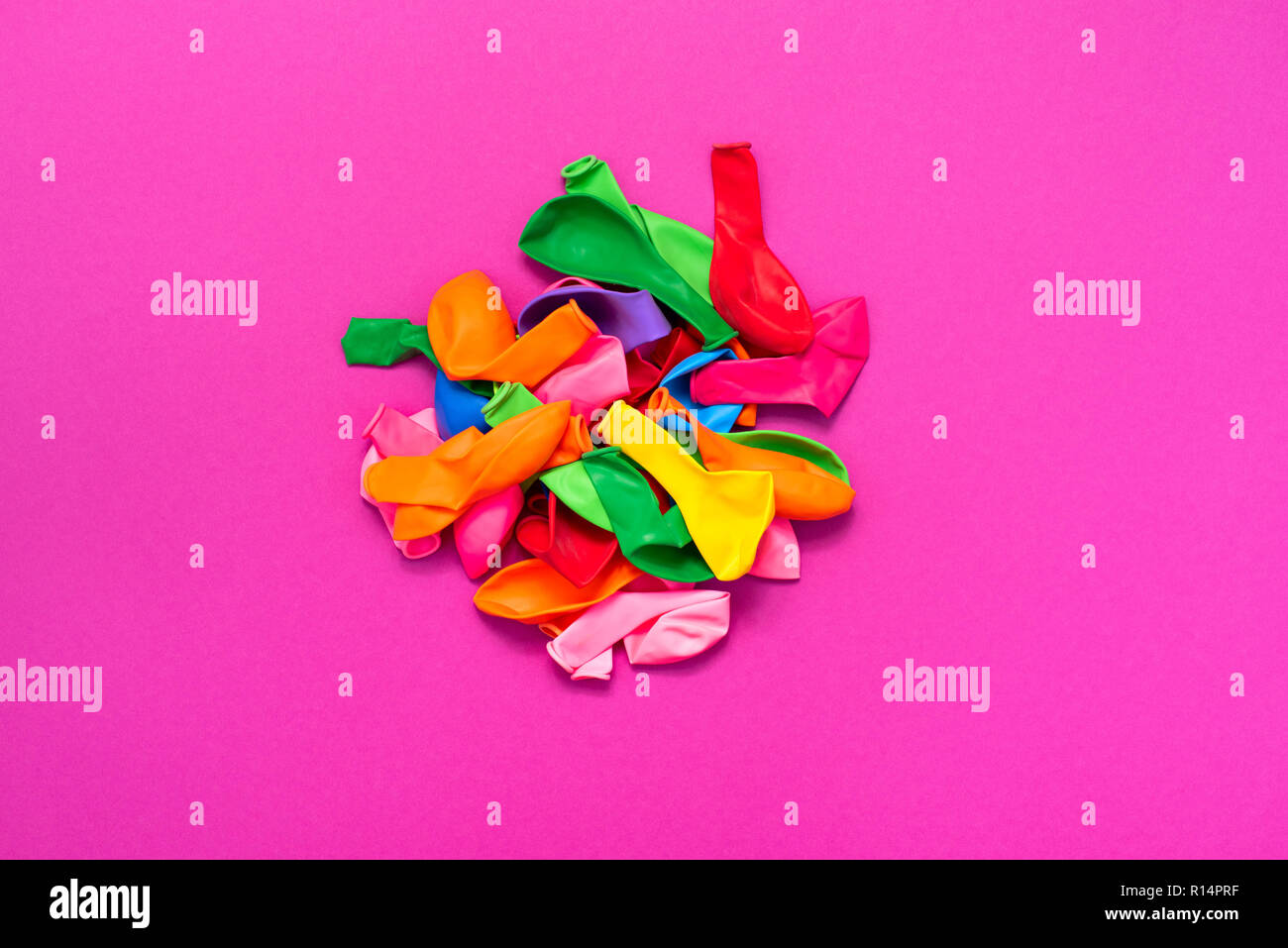 Set of colored balloons on pink background. Flat lay top view Stock ...