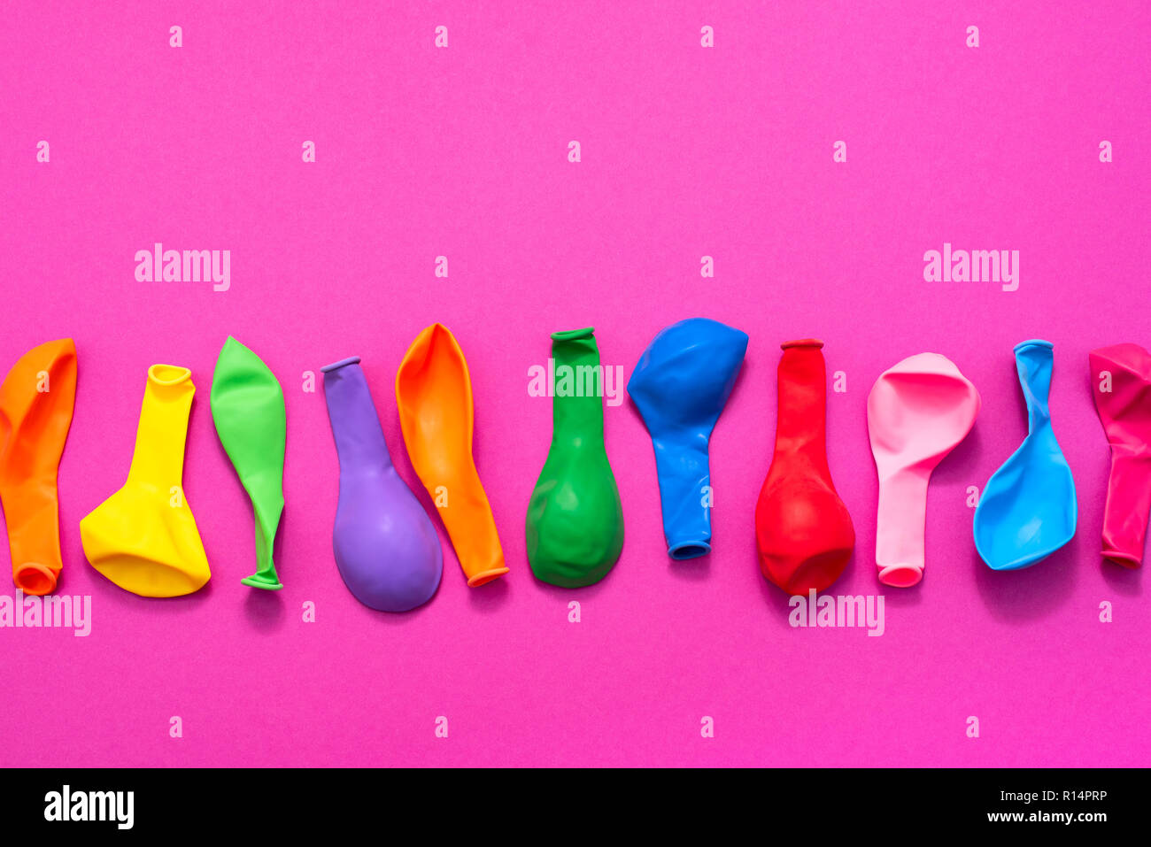 Set of colored balloons on pink background. Flat lay top view Stock ...