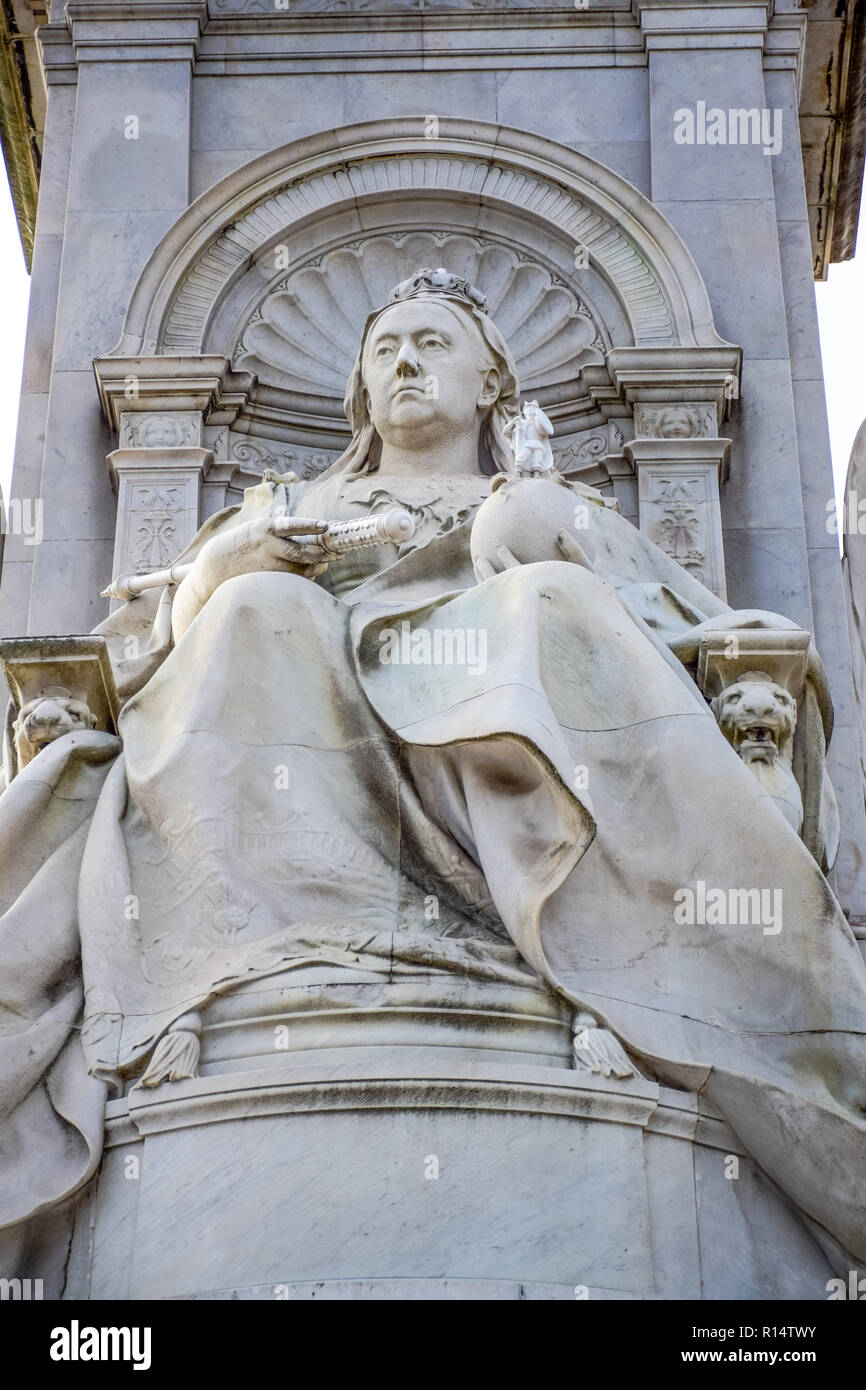 The queen victoria memorial is located in front of buckingham hi-res ...