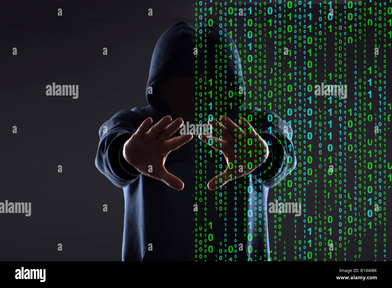 silhouette of a hacker in the hood on a black background, concept ...