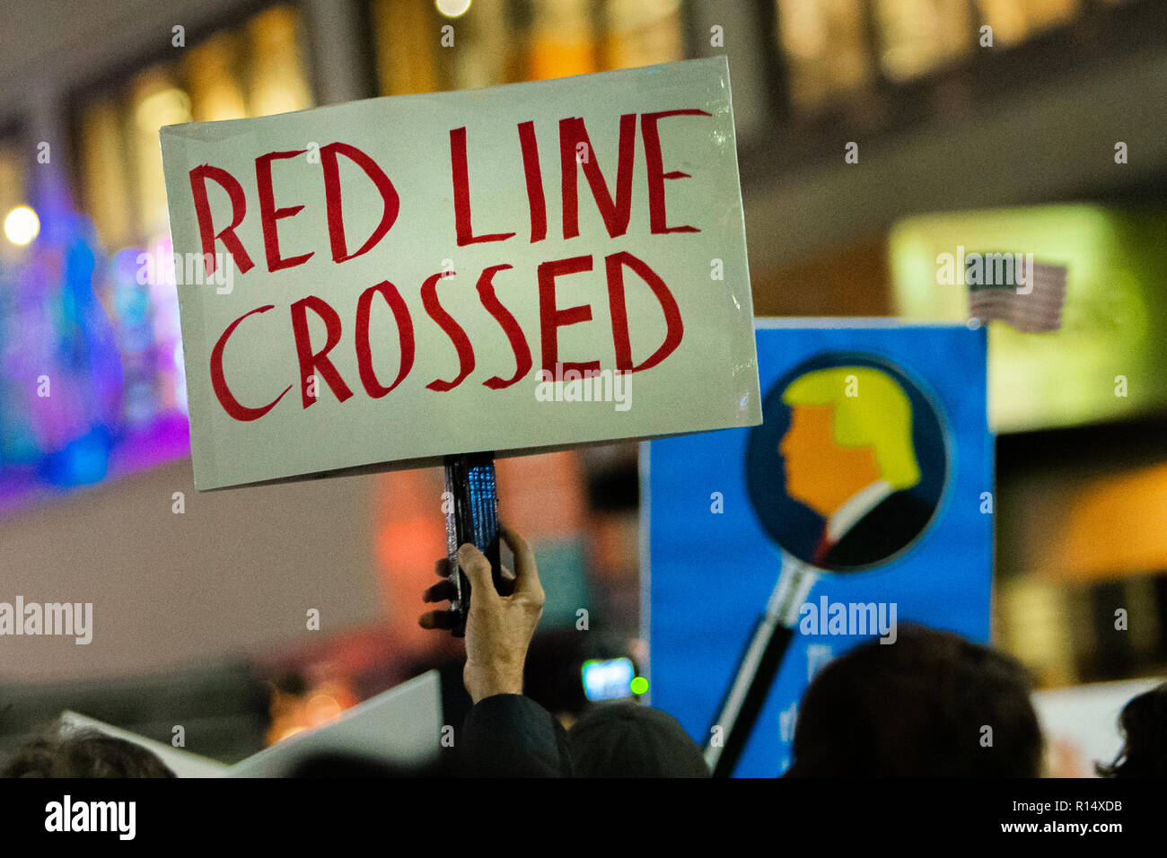A sign saying, red line crossed is seen during the protest. Thousands ...