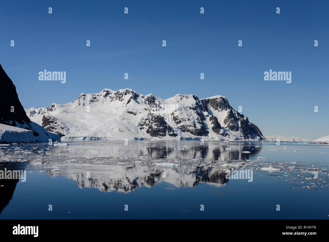Antarctic landscape with mountains and reflection view from sea ...