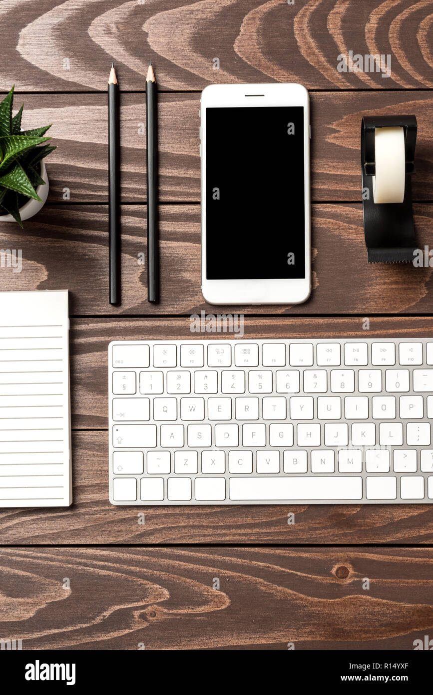 Overhead shot of wooden office desktop Stock Photo - Alamy