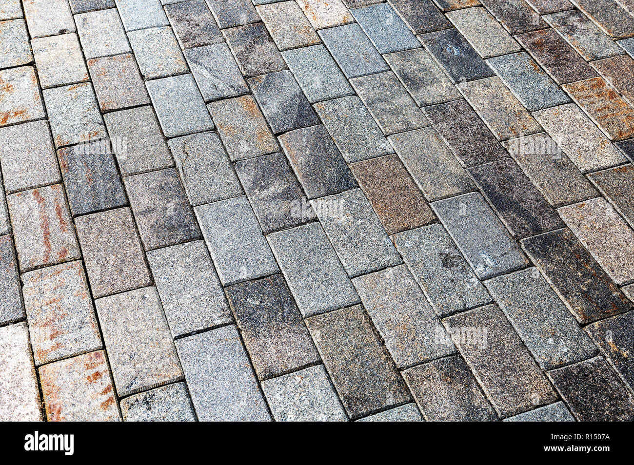 Grey paving stones as background texture closeup Stock Photo - Alamy