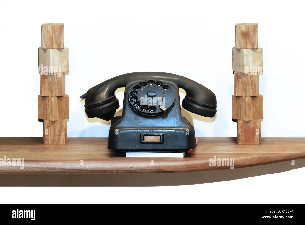 Retro landline telephone on wooden shelf inside interior Stock Photo ...