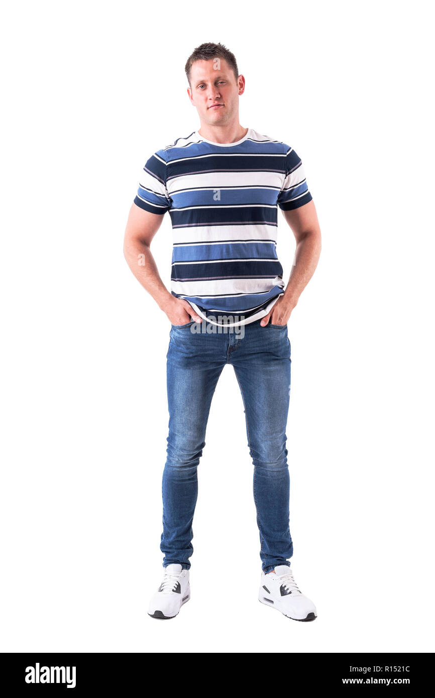 Successful serious man in casual clothes posing and looking at camera ...