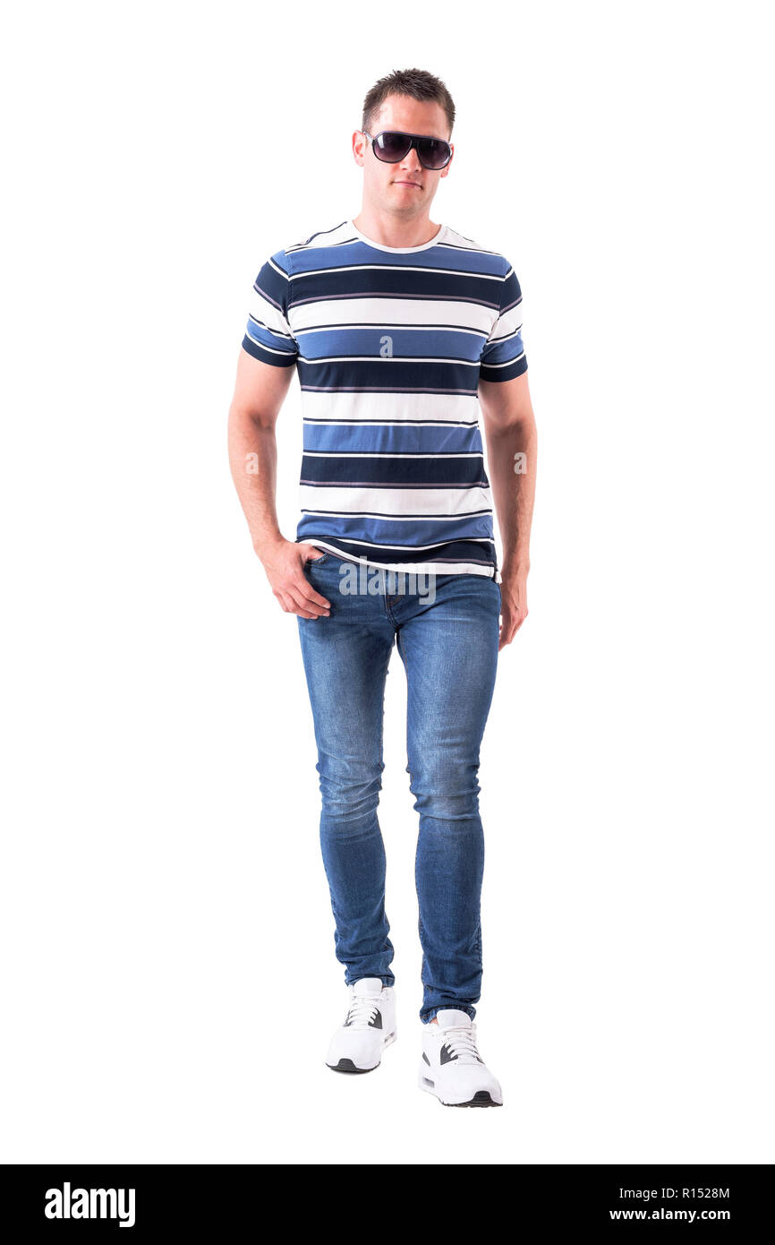 Confident macho serious man walking and approaching and looking at ...