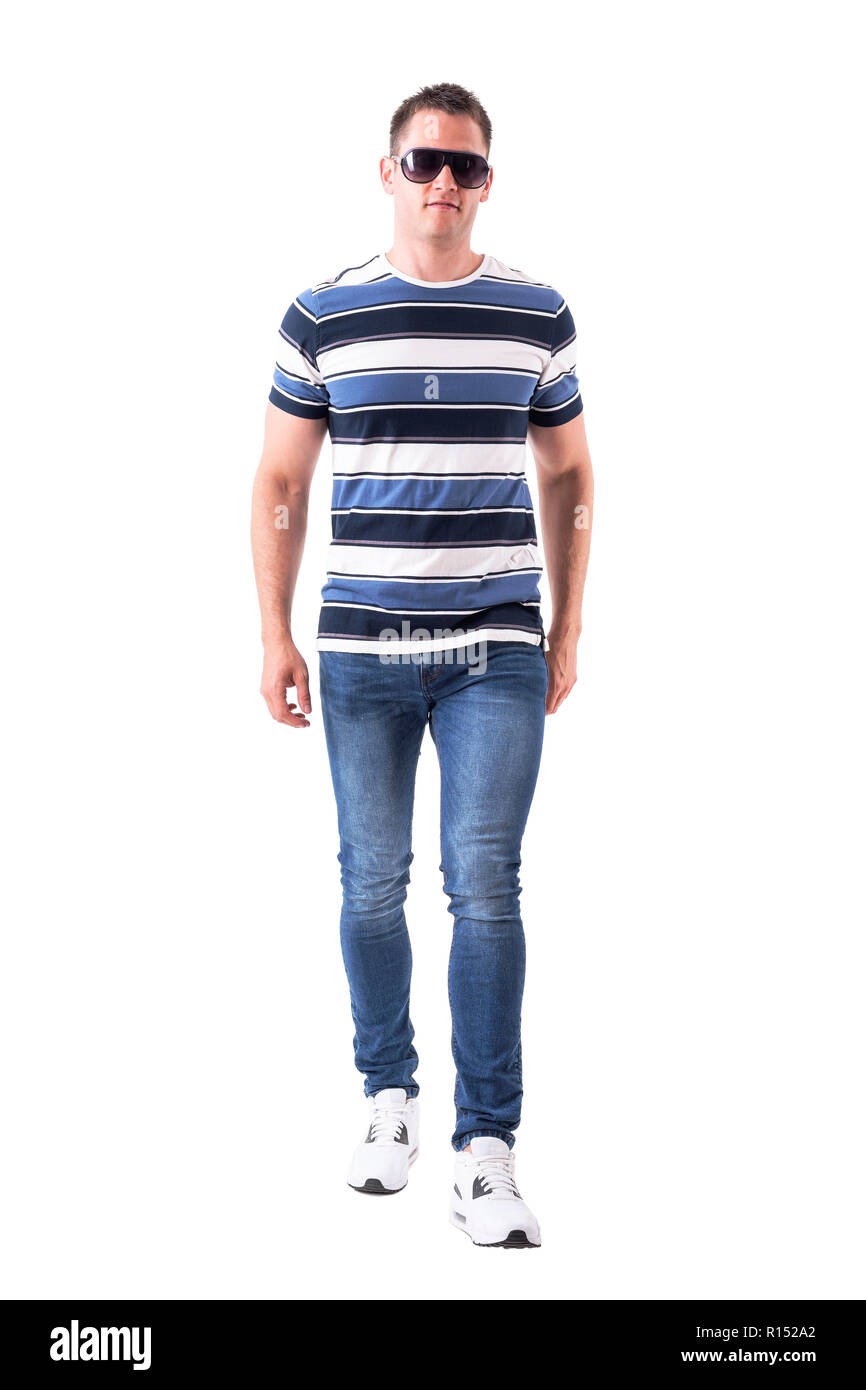 Front view of adult stylish man with sunglasses approaching and looking ...