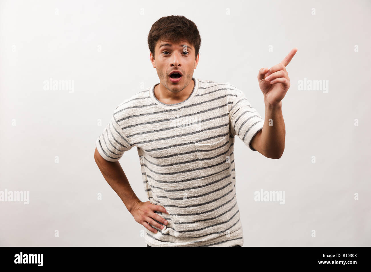 Image of shocked handsome man standing isolated over white background ...