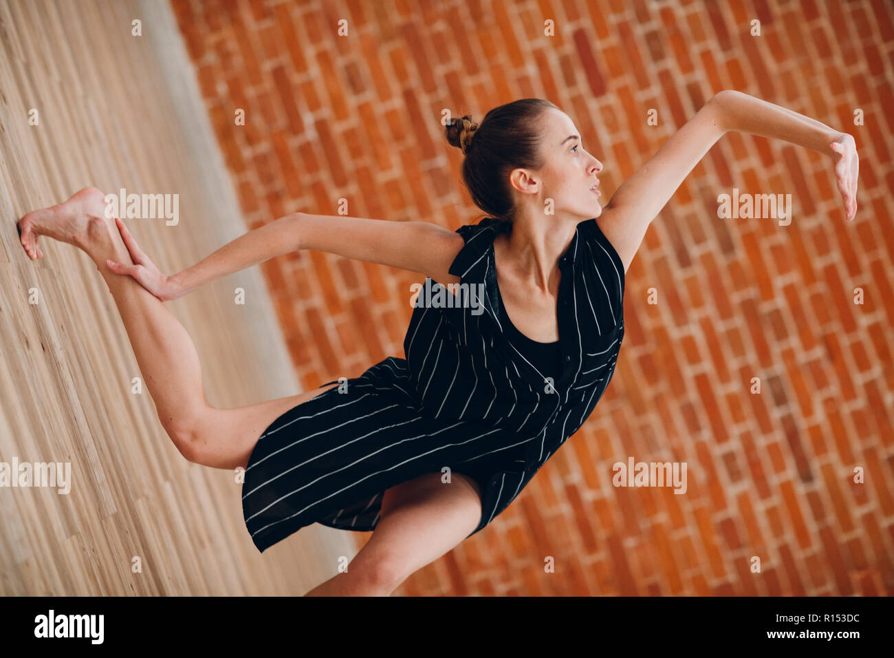 Young woman dancing contemporary in a dance studio Stock Photo - Alamy